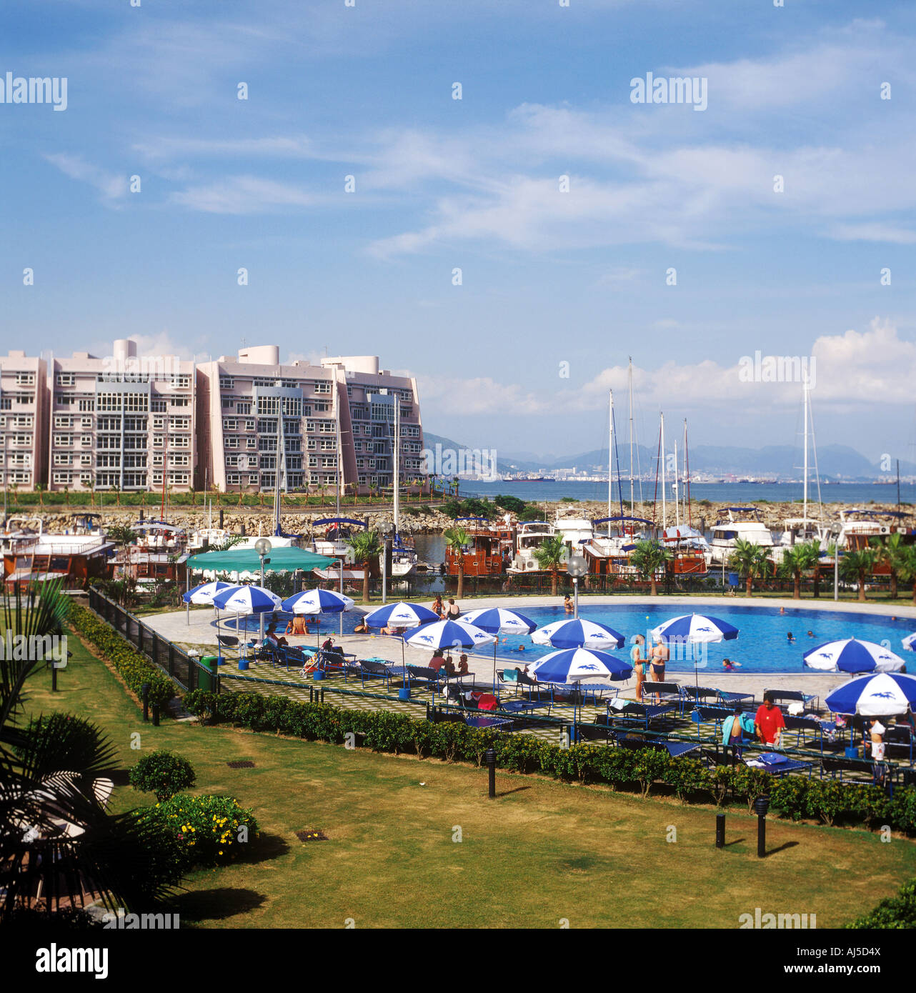 Swimming pool and garden at a luxurious residential compound Stock ...