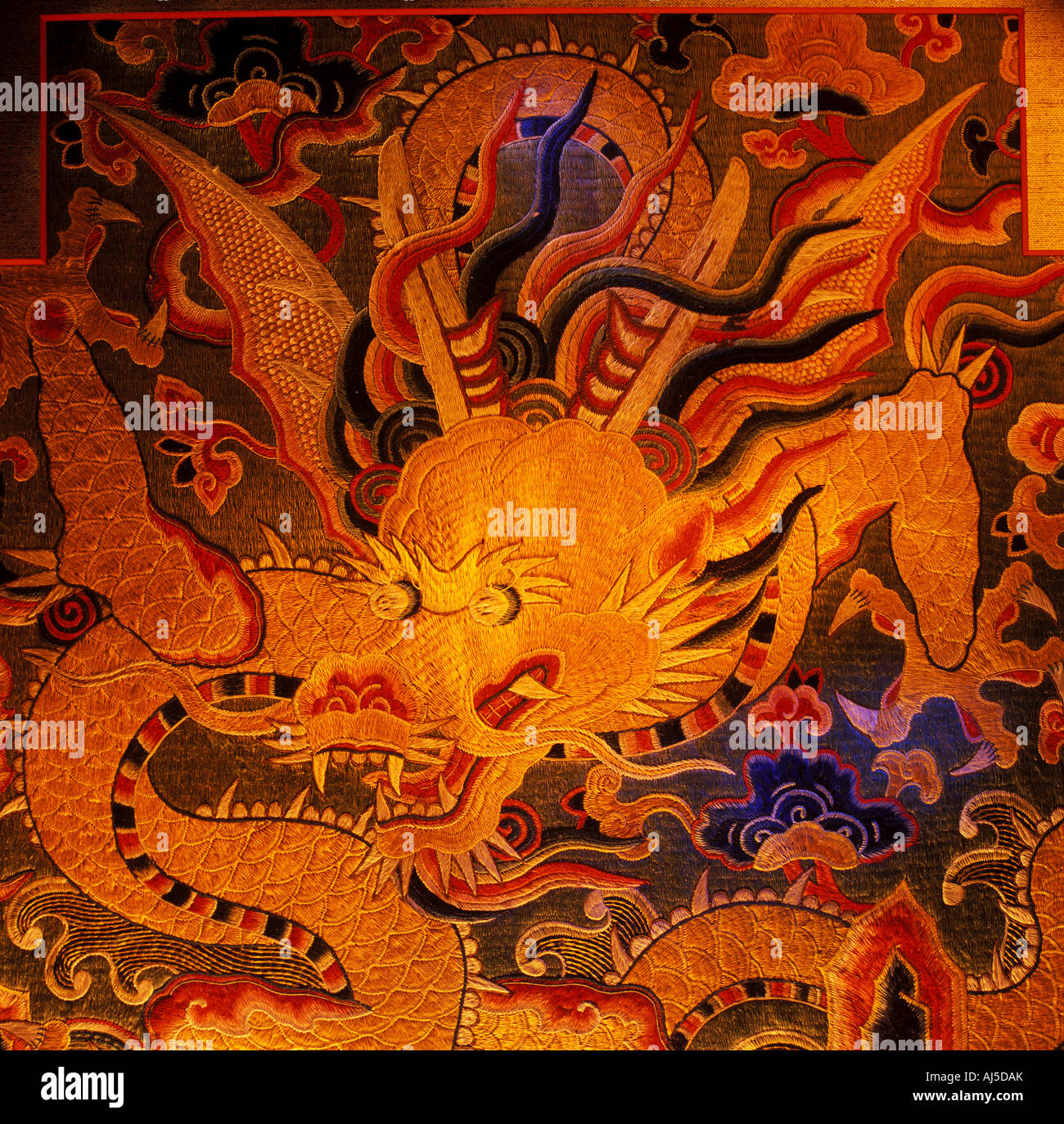 Fabric embroidery with a flying dragon pattern Stock Photo - Alamy