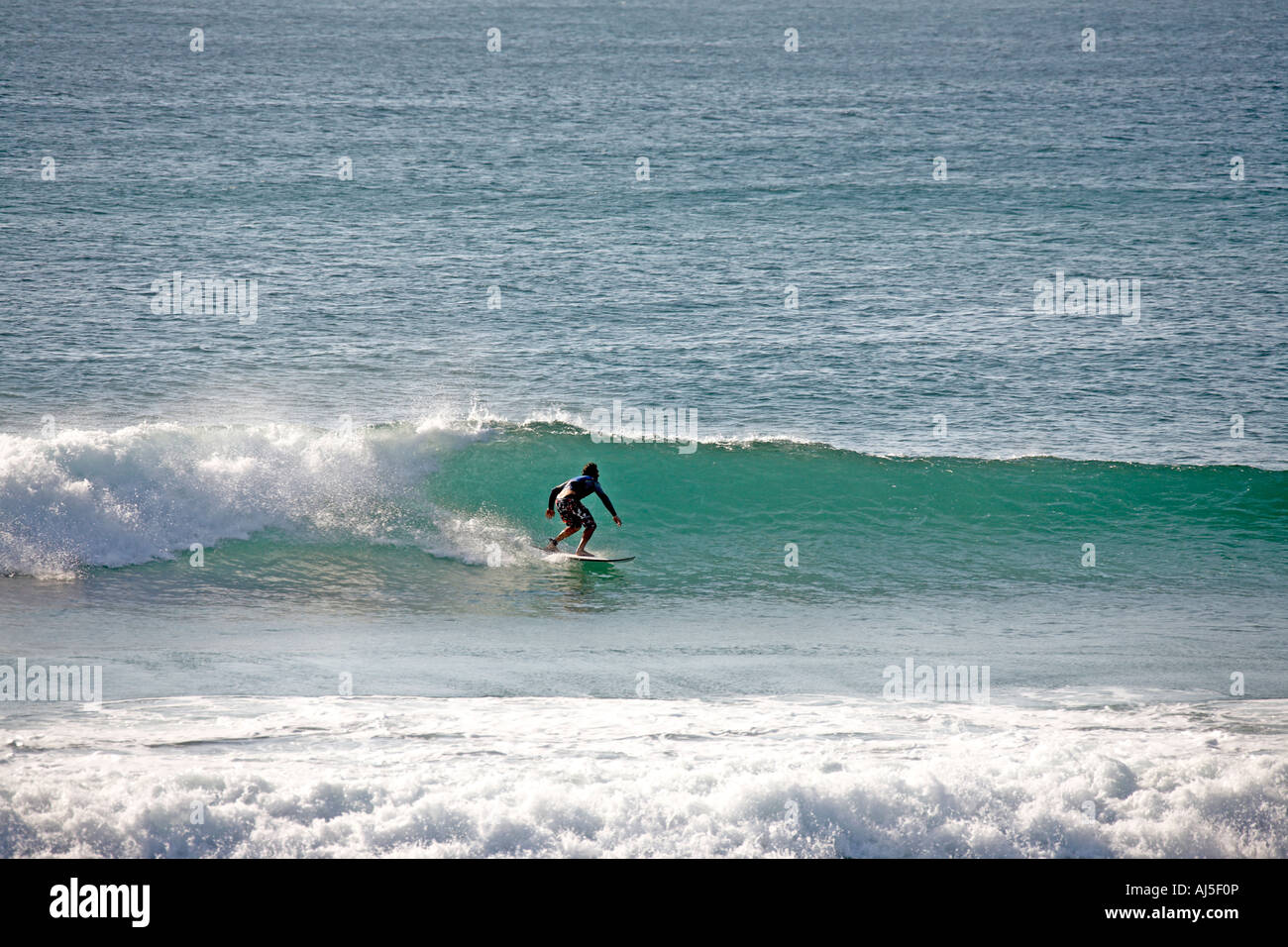 Surfer surfing on sea wave at Boambee Beach Coffs Harbour in New South ...
