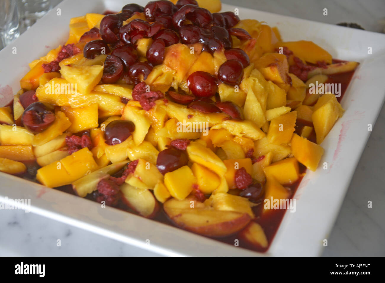 dish of peaches mango and cherry fruit for Christmas day breakfast in ...