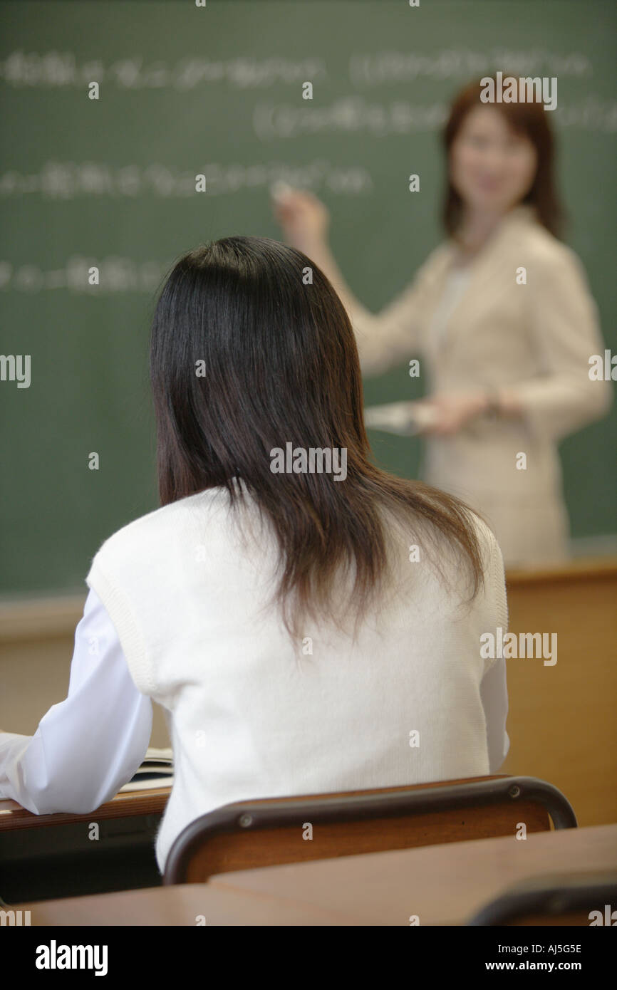 Rear view of high school girl studying Stock Photo - Alamy