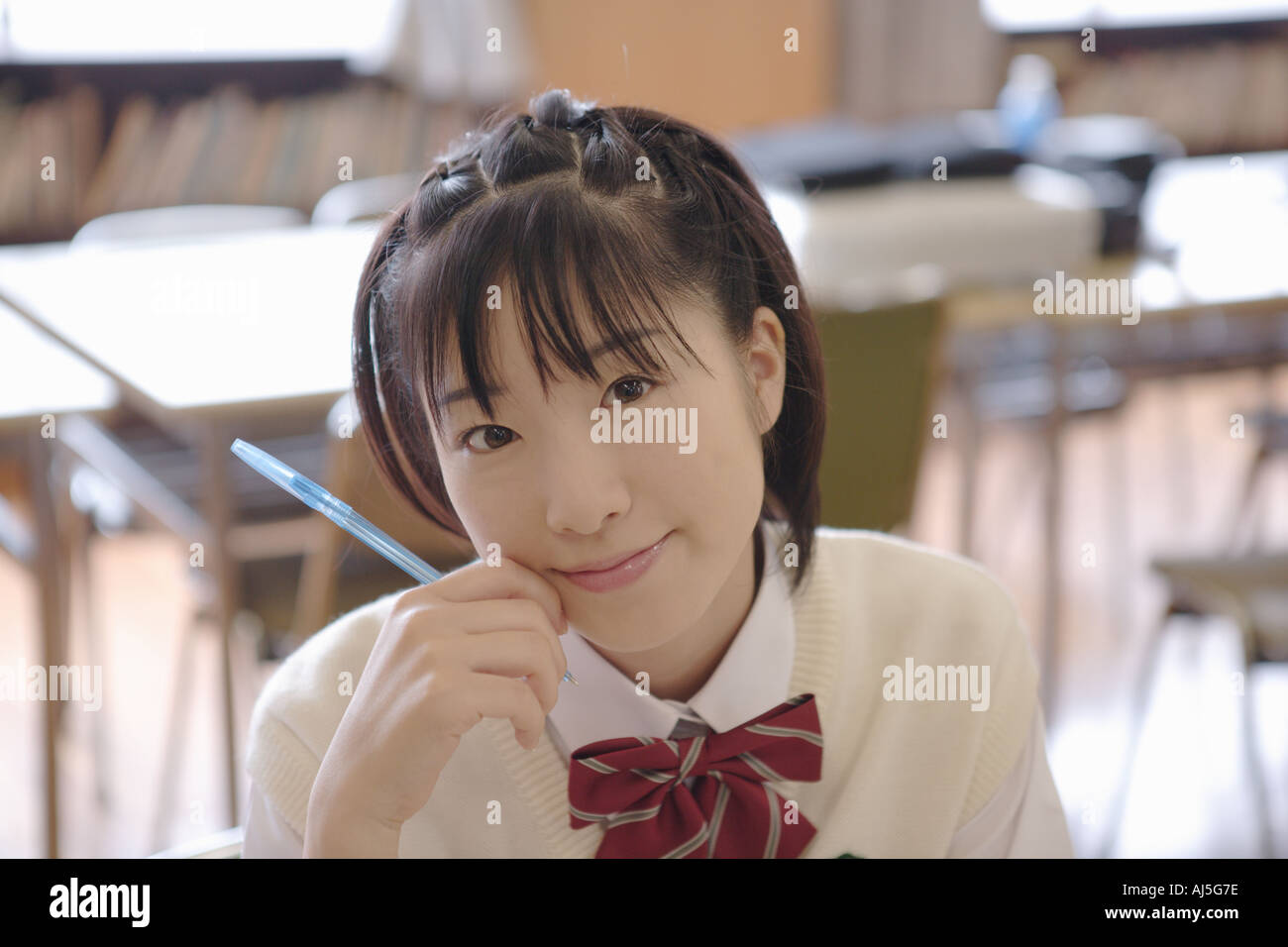 High school girl studying in library Stock Photo - Alamy
