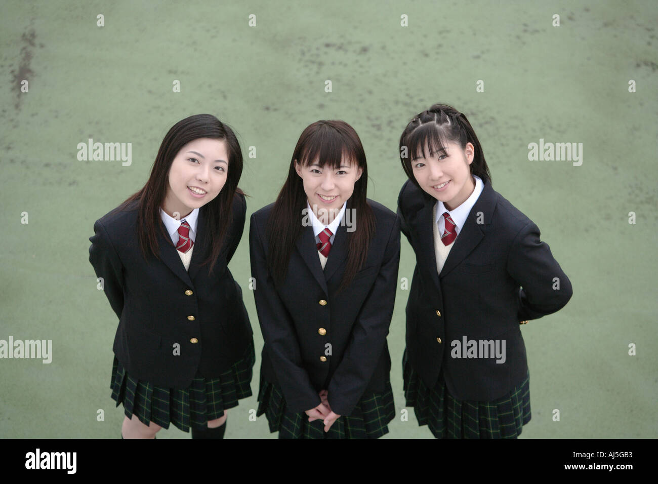 Three high school girls smiling Stock Photo - Alamy