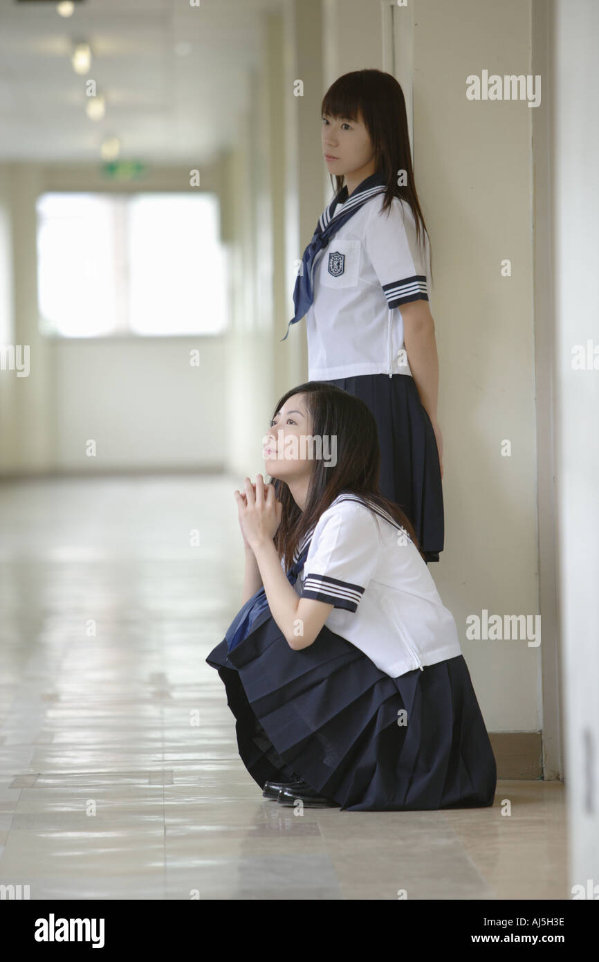 Two high school girls in school corridor Stock Photo - Alamy