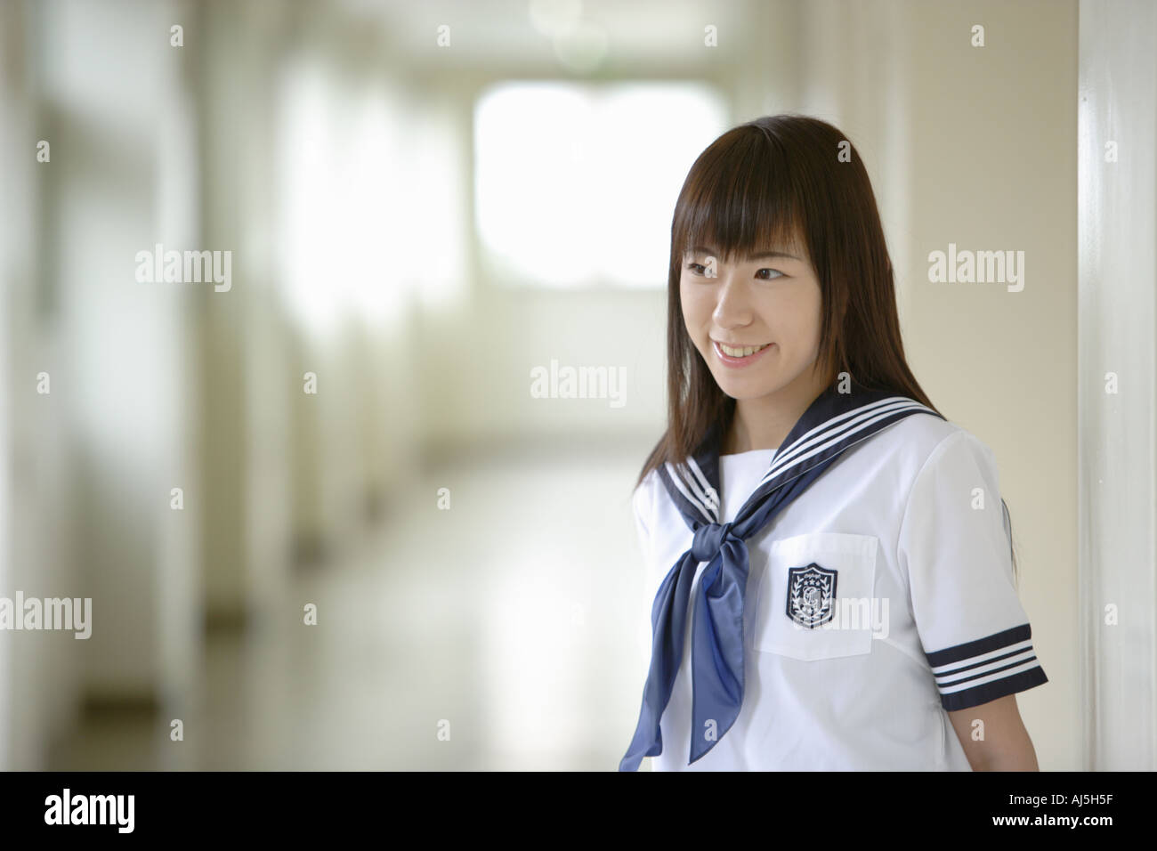 High school girl in school corridor Stock Photo - Alamy