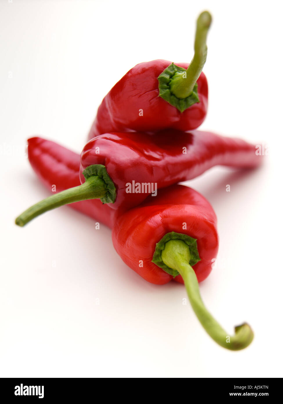 Whole red sweet point peppers stacked hi-res stock photography and ...