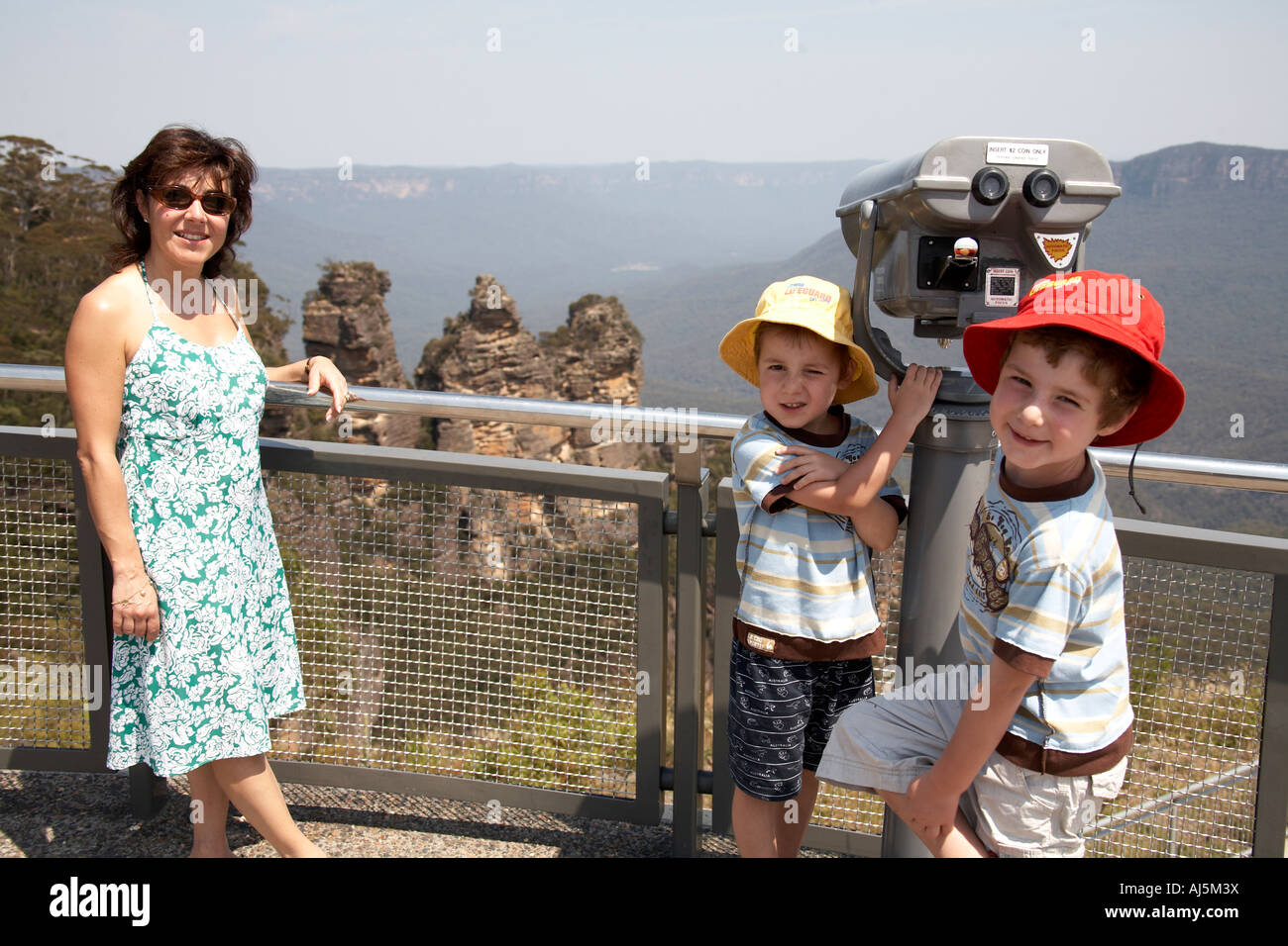 Mother and two young boy sons brothers at Three Sisters rocks from ...