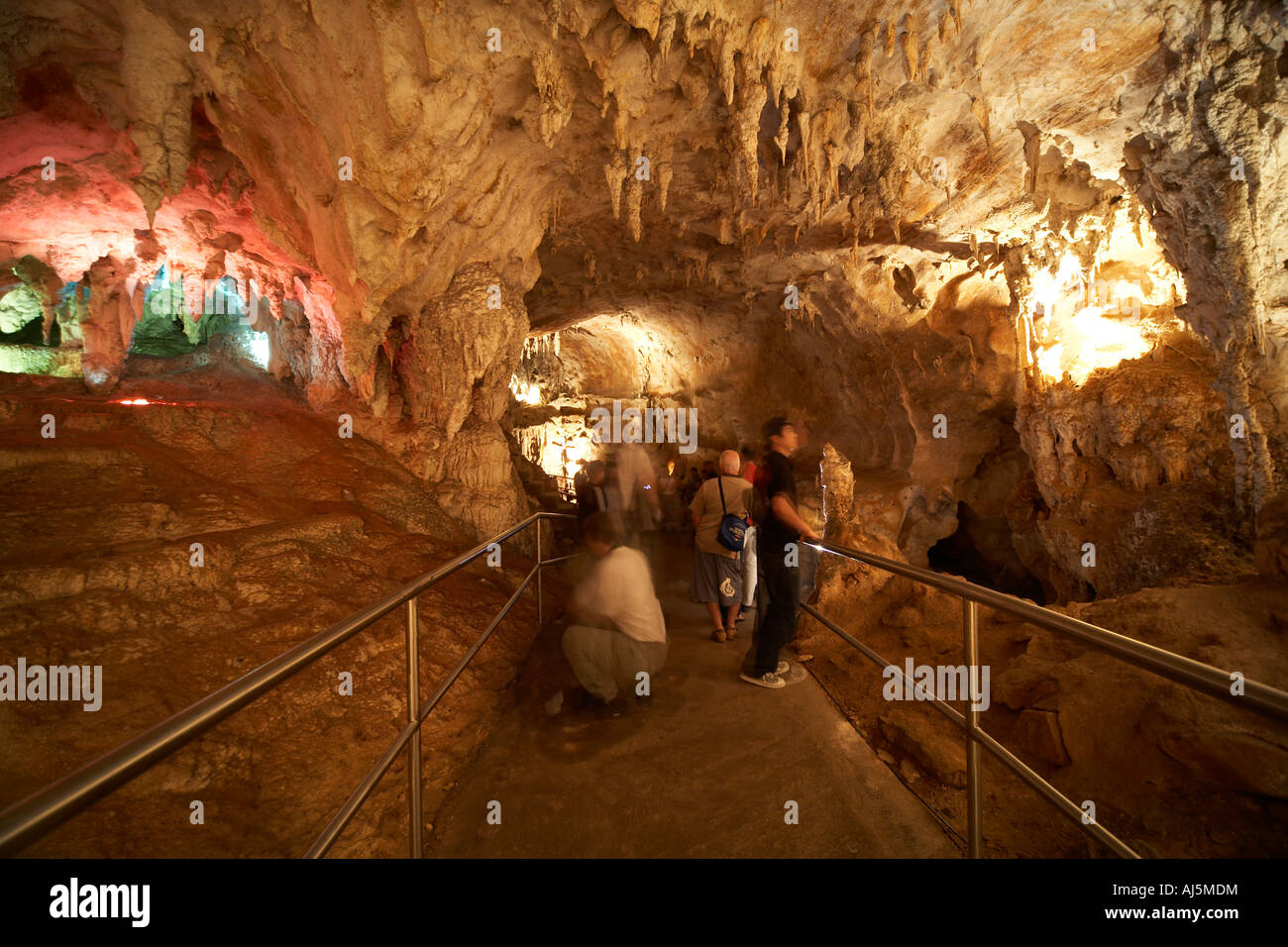 Stalagmites and stalagtites with people in Chifley Cave at Jenolan ...