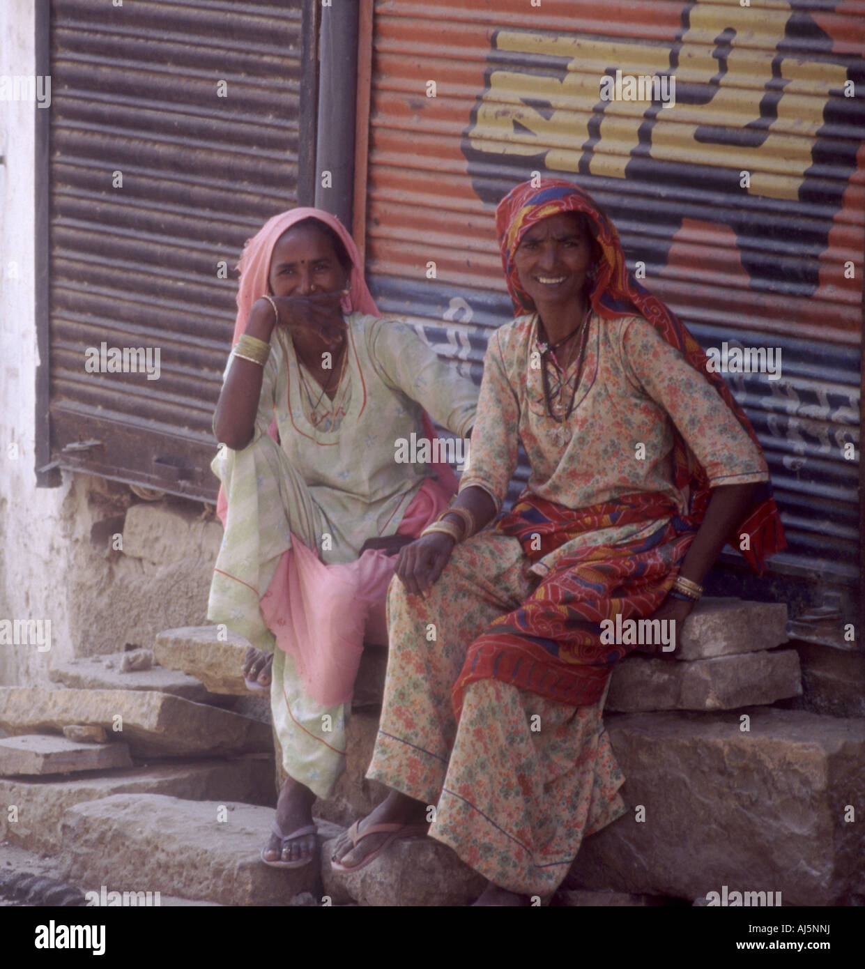 Two beautiful Indian Women wearing traditional Indian Saris sitting ...