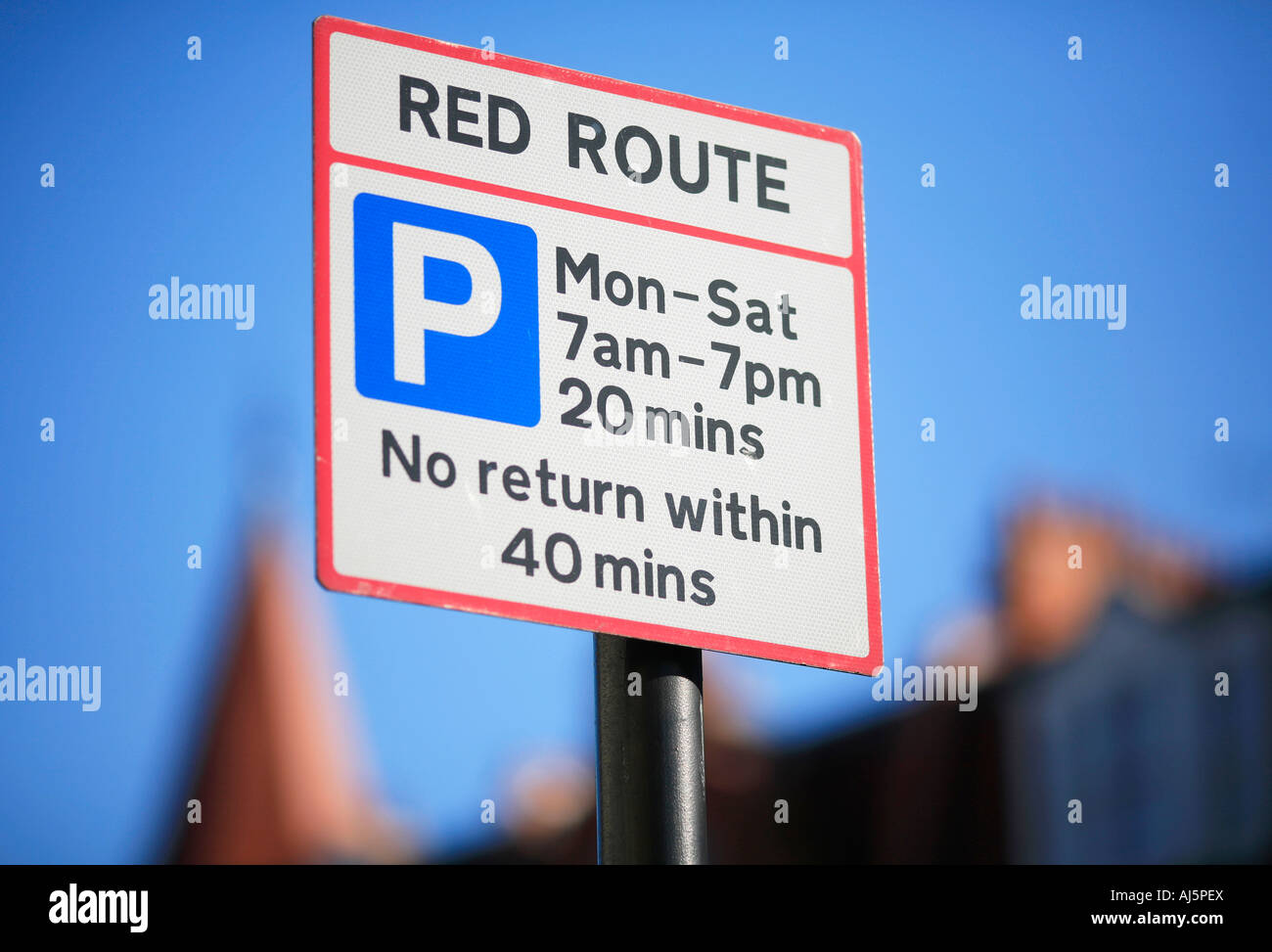 Red route sign on main road in London Stock Photo - Alamy