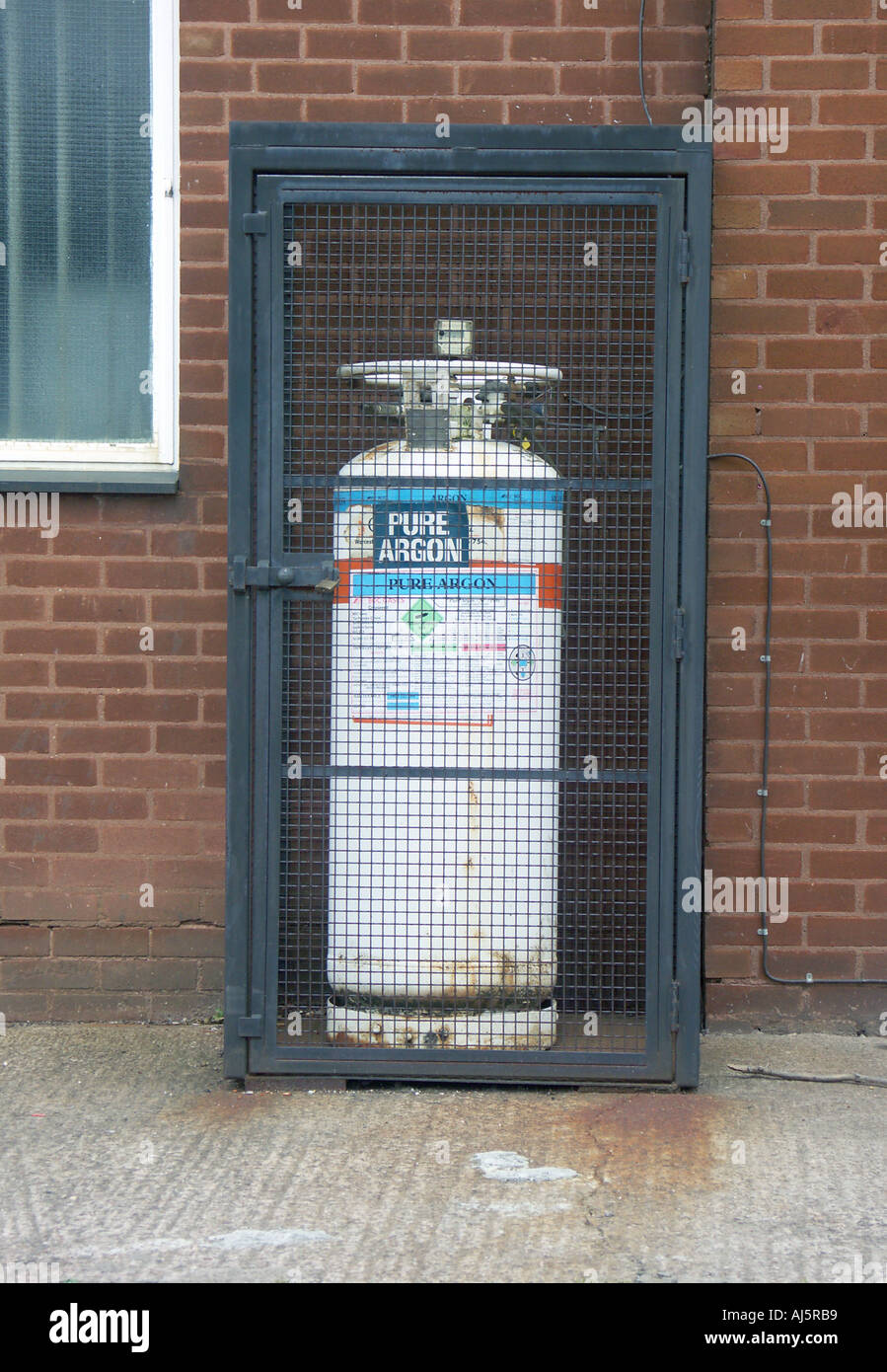 Pure Argon Gas Cylinder in Cage Stock Photo - Alamy