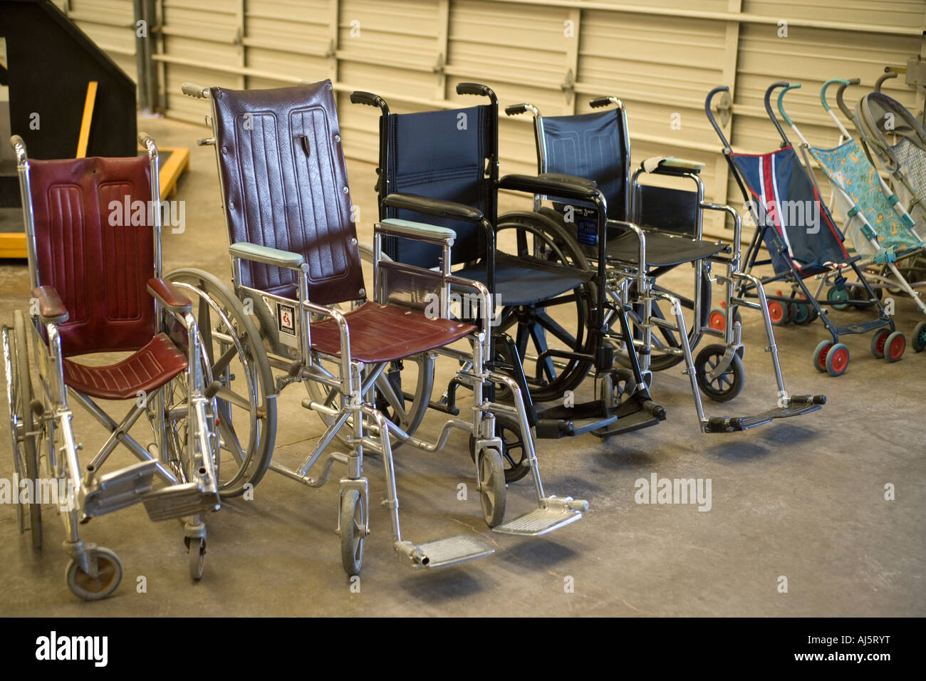 Row of Wheelchairs and Push Chairs Stock Photo - Alamy