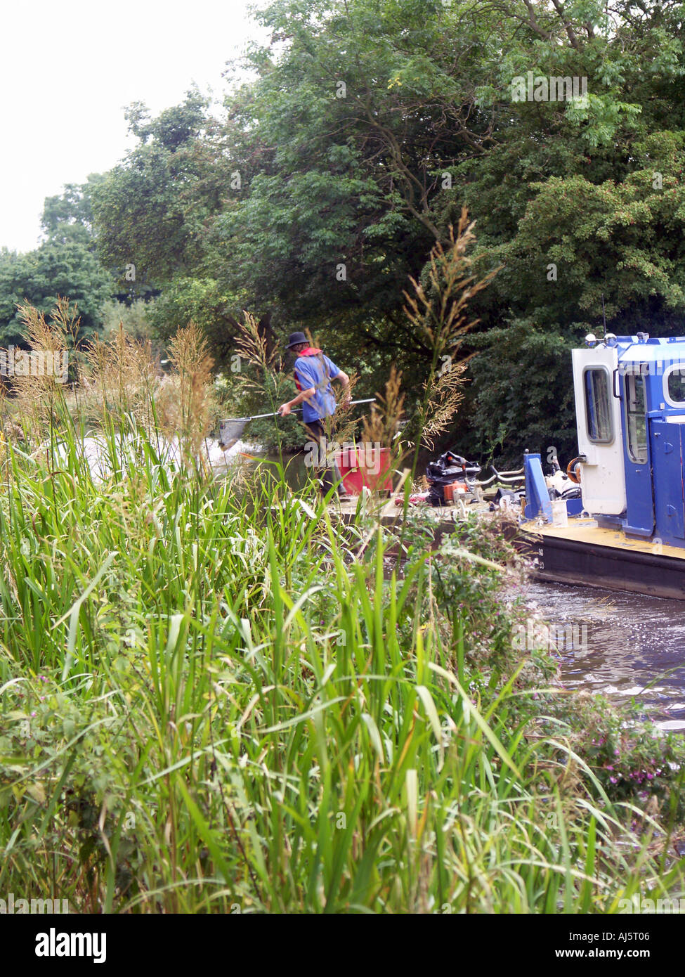 Picking rubbish from canal hi-res stock photography and images - Alamy