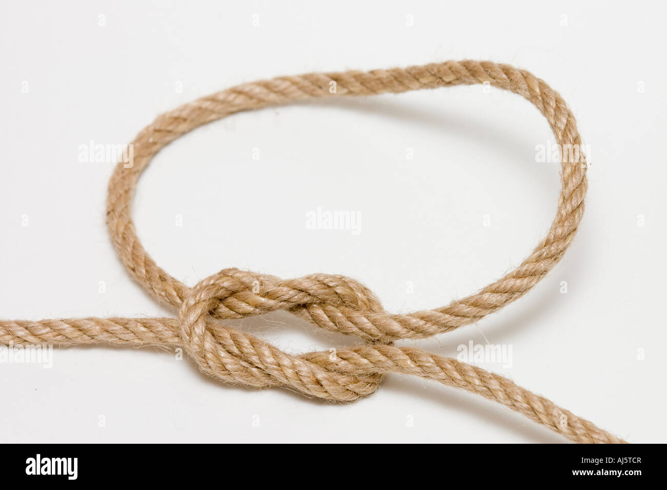 detail of reef knot on natural rope Stock Photo - Alamy