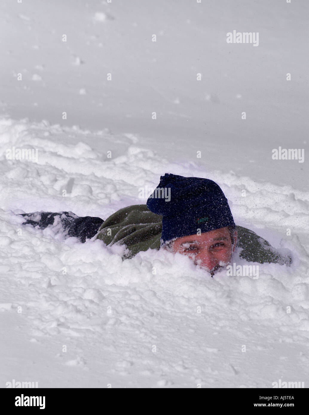 Man buried in Snow Stock Photo - Alamy
