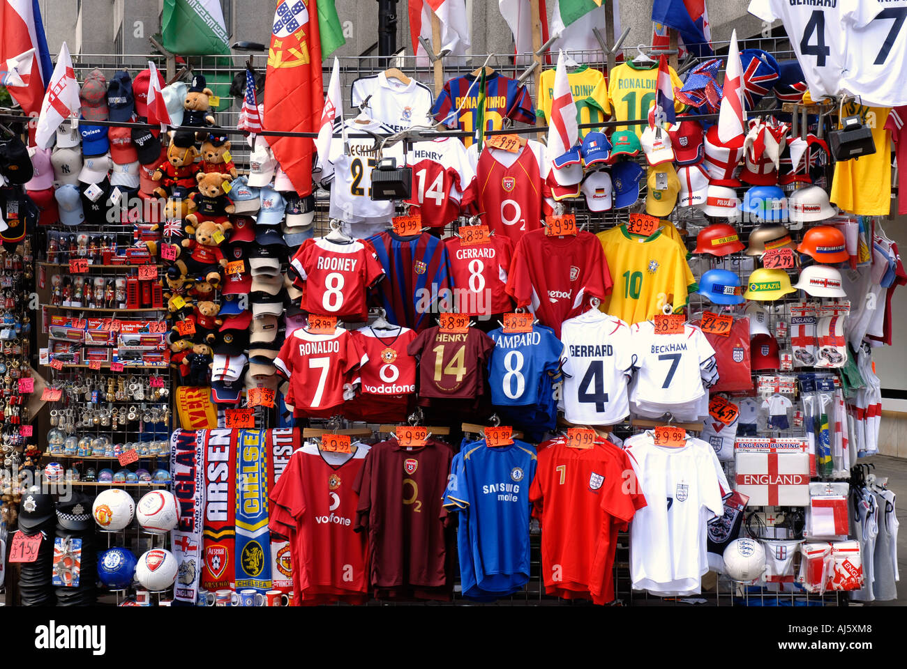 Football shirts on an Oxford Street stall London Stock Photo - Alamy
