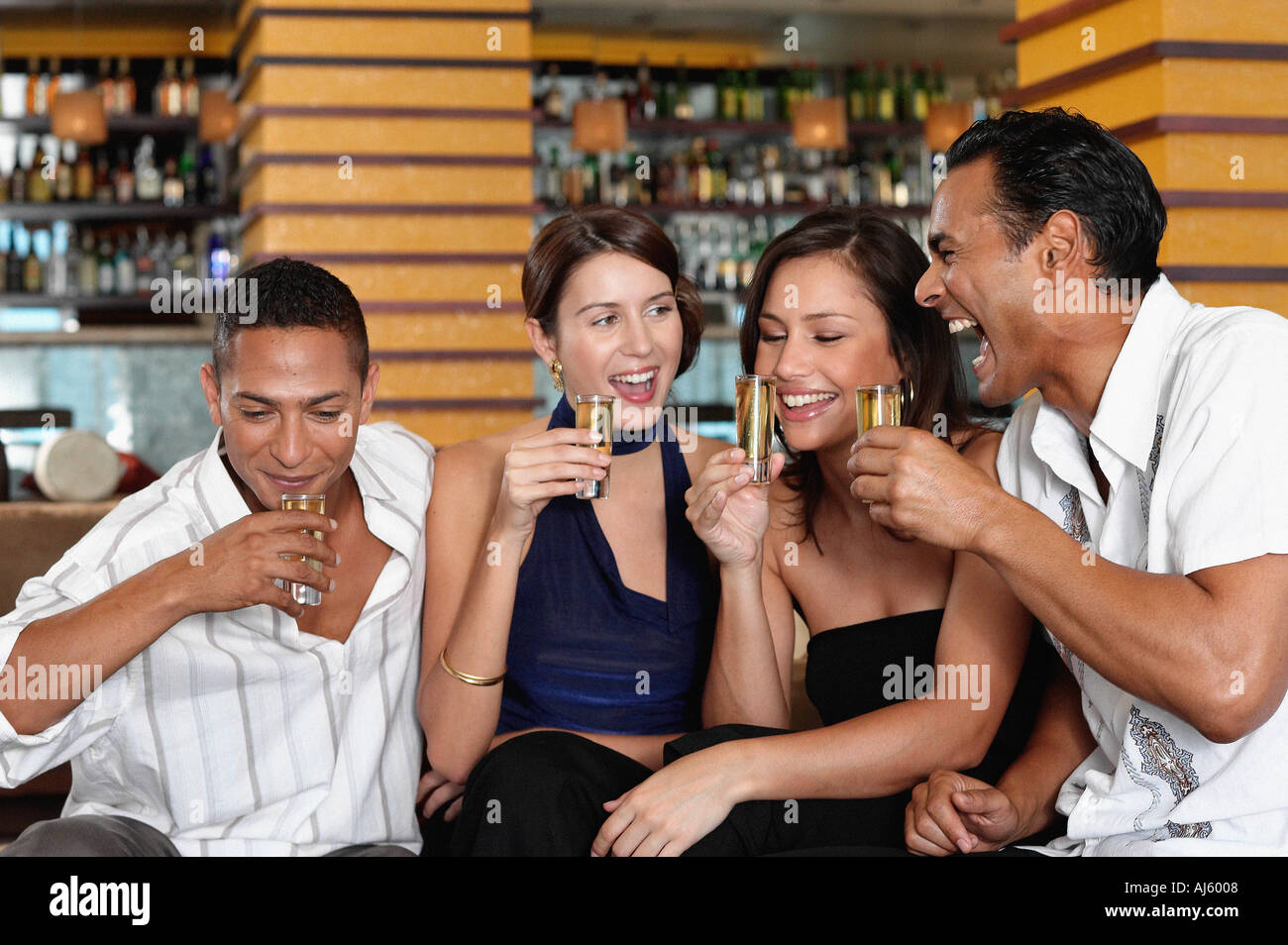 Friends drinking in bar Stock Photo - Alamy