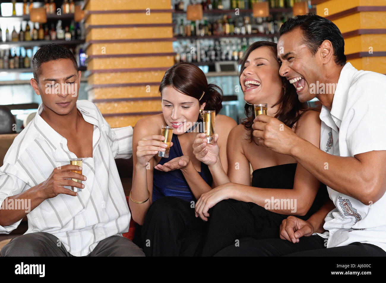 Friends drinking in bar Stock Photo - Alamy
