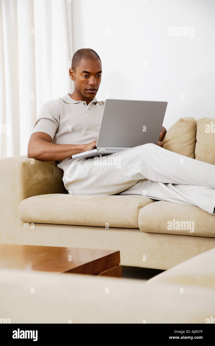 Man using laptop computer Stock Photo - Alamy