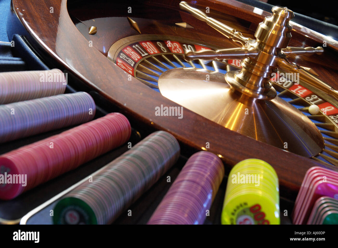 chips next to a roulette wheel Stock Photo - Alamy