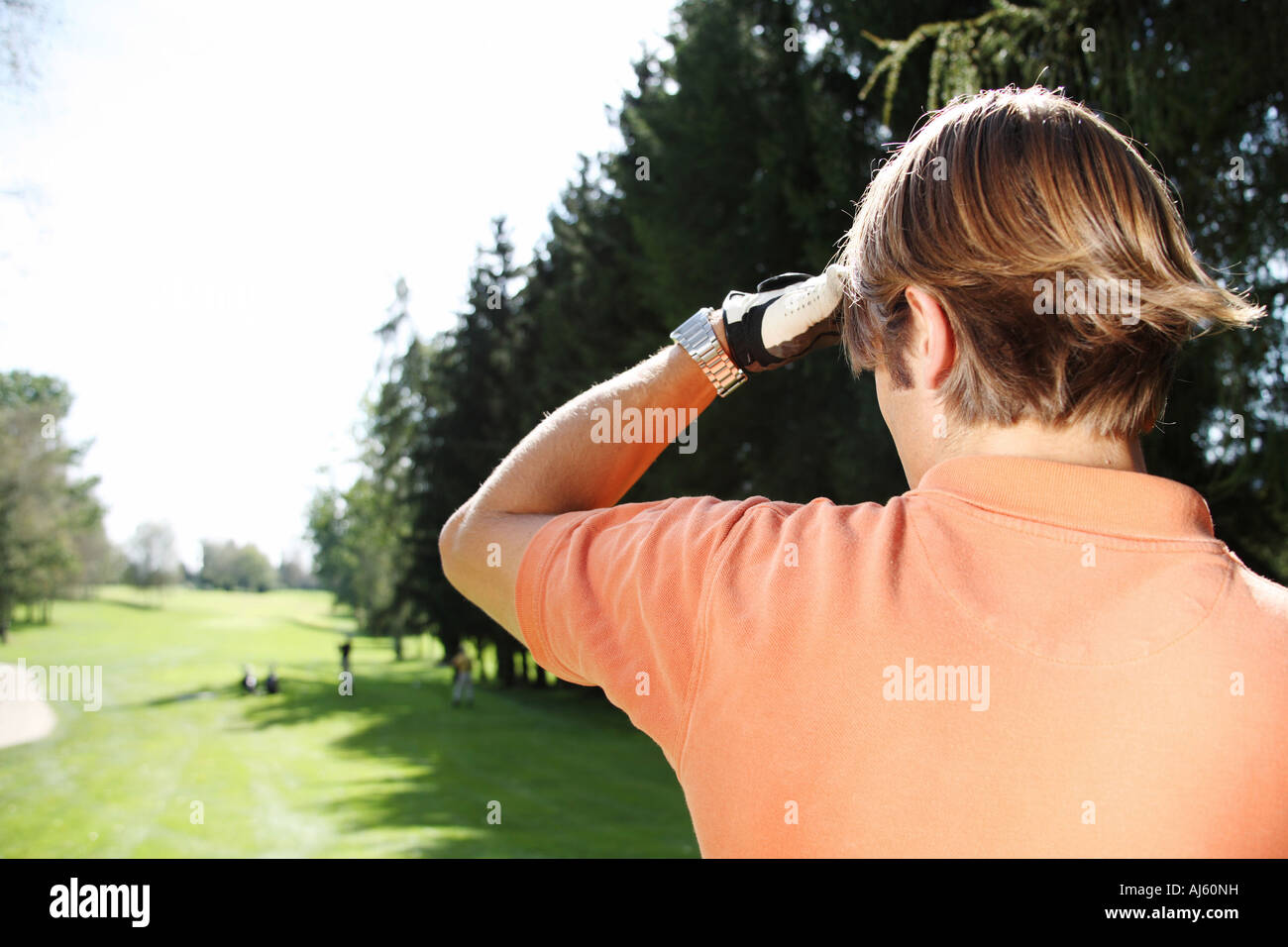 golfing man looking out Stock Photo - Alamy