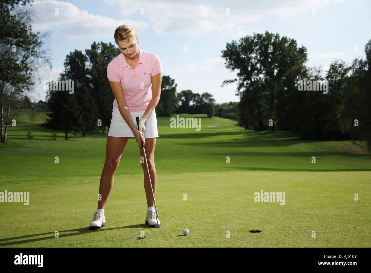 woman playing golf Stock Photo - Alamy