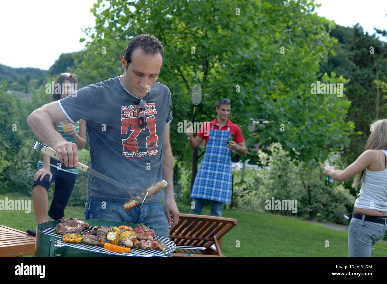 young people having a barbecue Stock Photo - Alamy