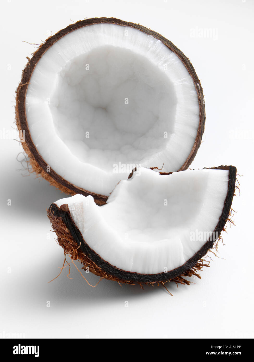 Open coconut on a white background Stock Photo - Alamy