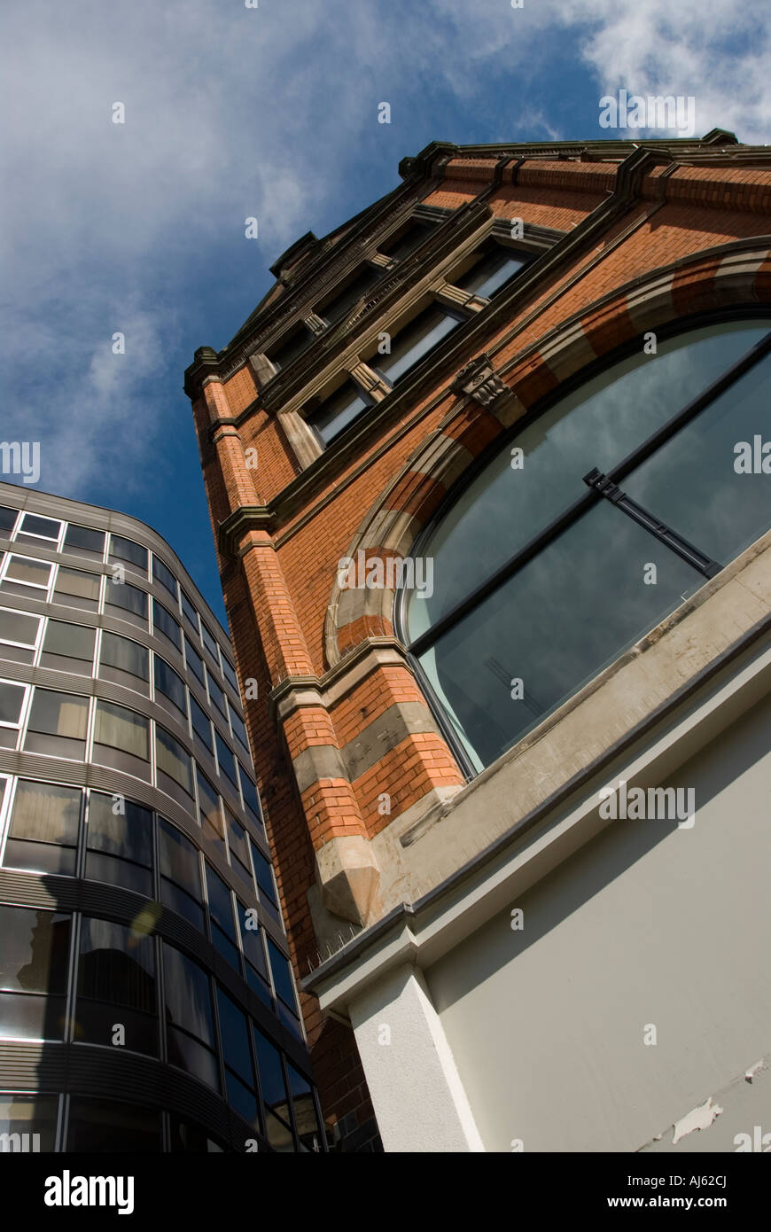 Stock Photo of a new office building next to a traditional building ...