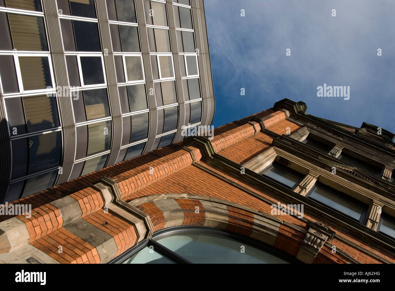 Stock Photo of a new office building next to a traditional building ...