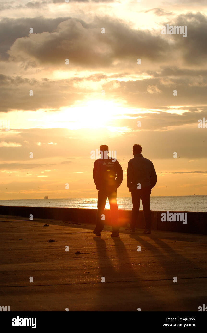 Walking people with sundown Stock Photo - Alamy
