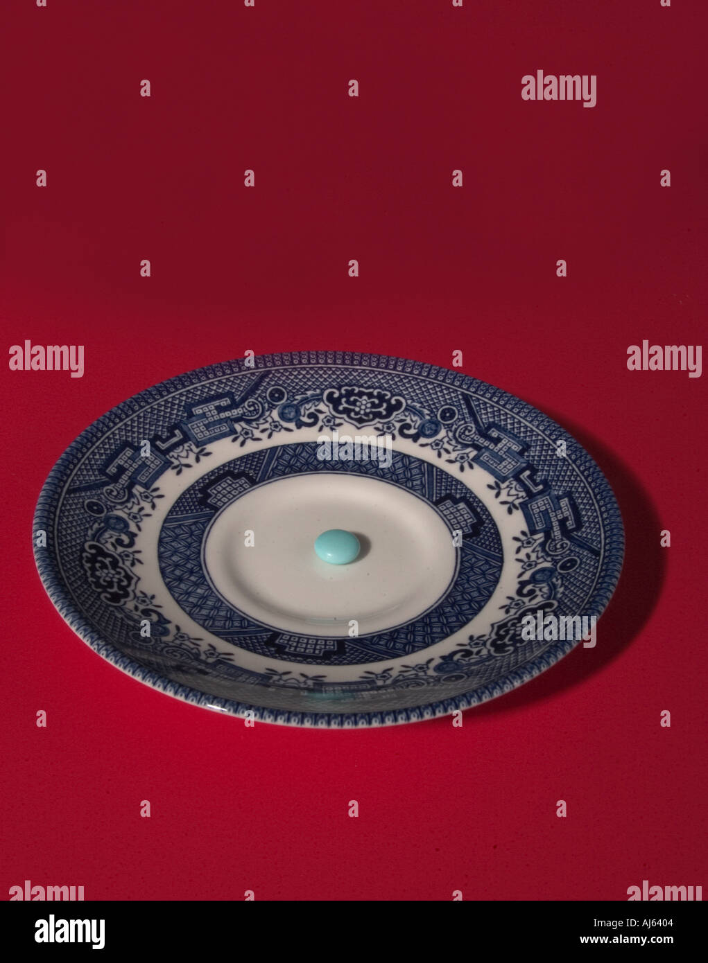 Blue pill on plate hi-res stock photography and images - Alamy