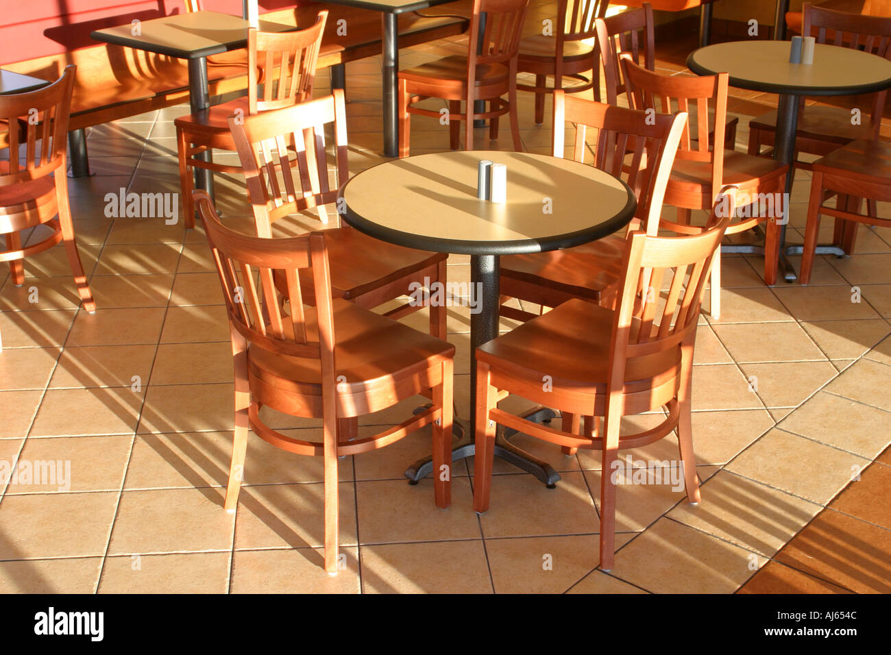 Empty table and chairs in a restaurant Stock Photo - Alamy