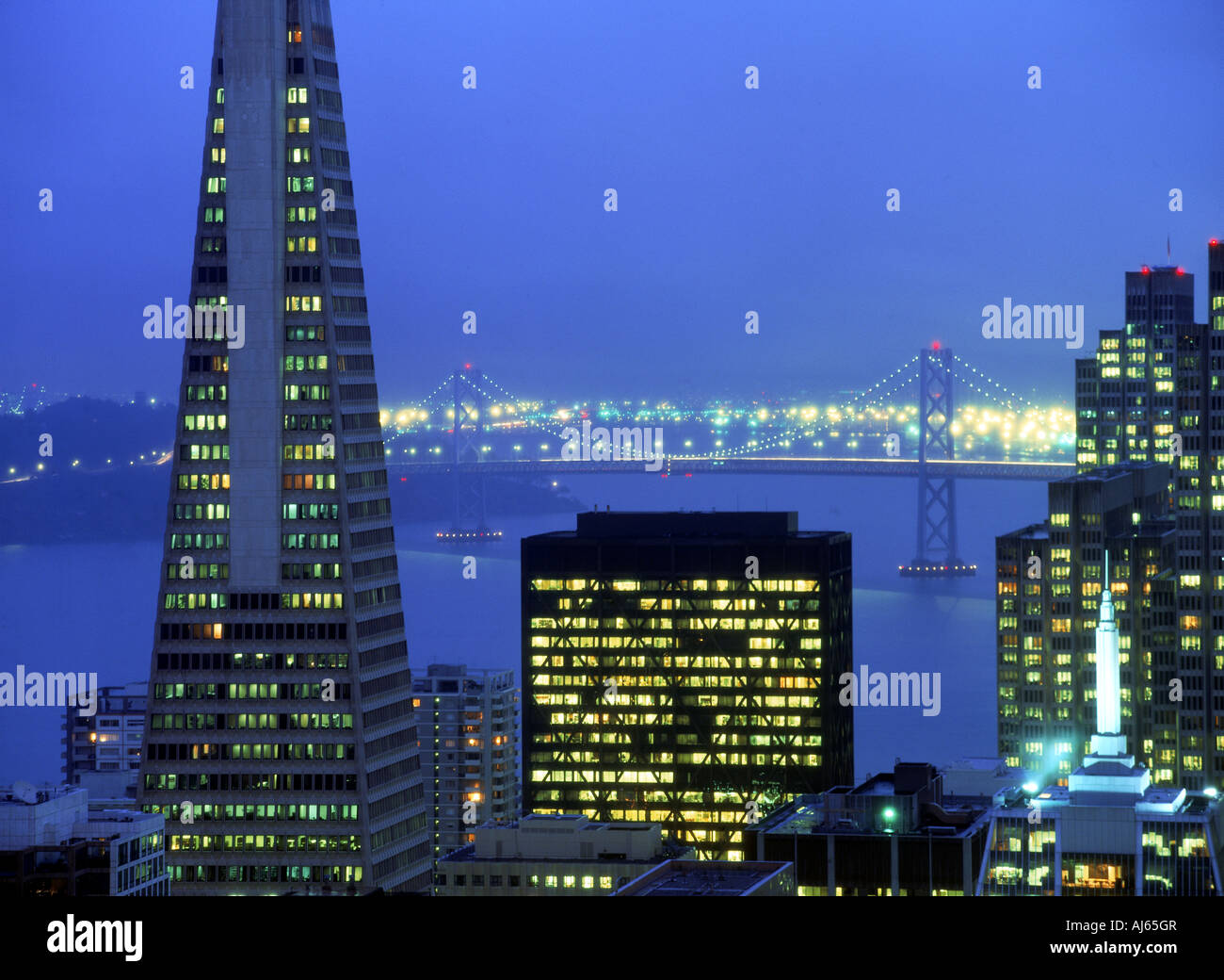 Transamerica Pyramid and Oakland Bay Bridge with San Francisco skyline ...