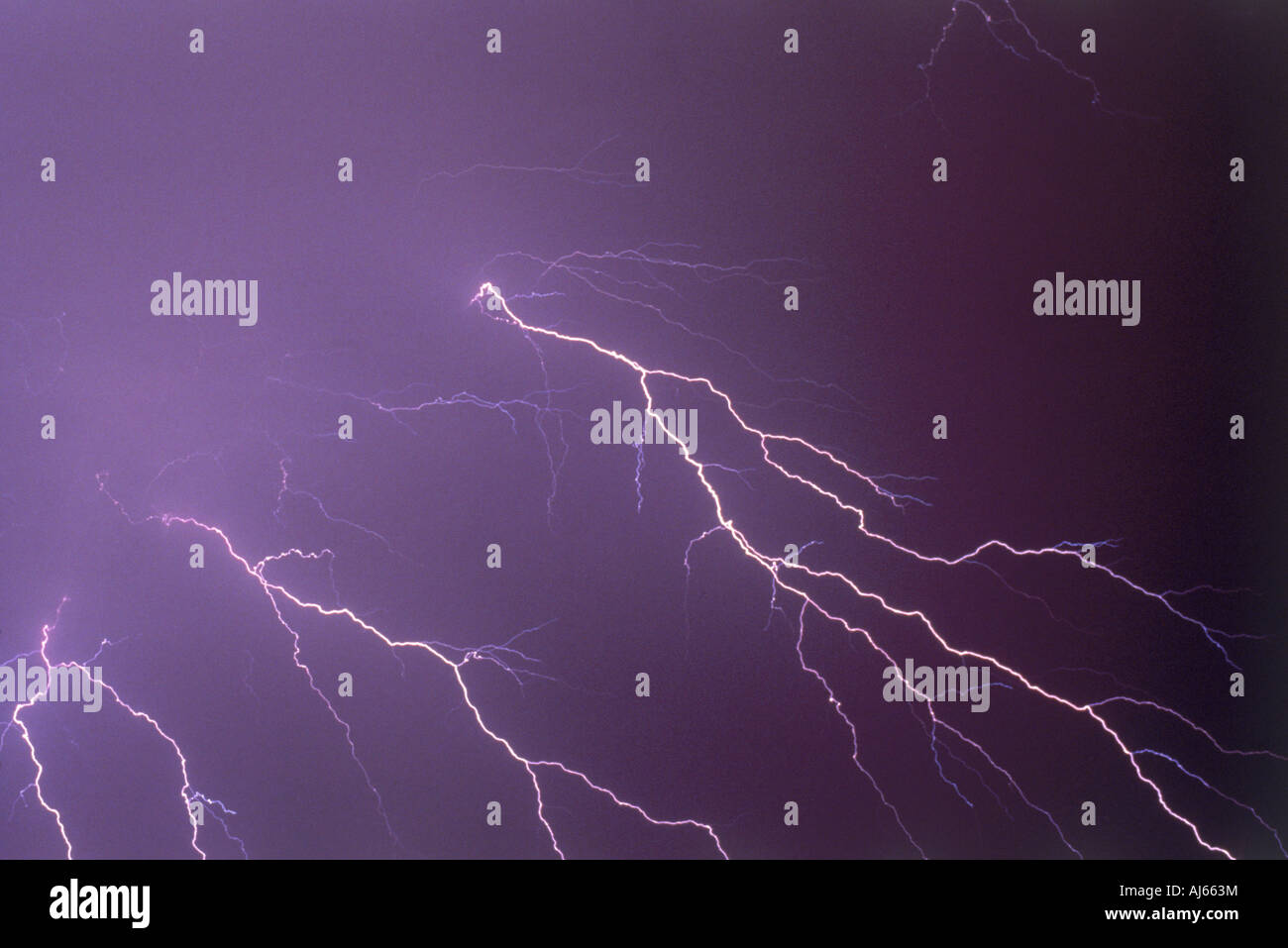 Lightning bolts cutting through night sky Stock Photo - Alamy