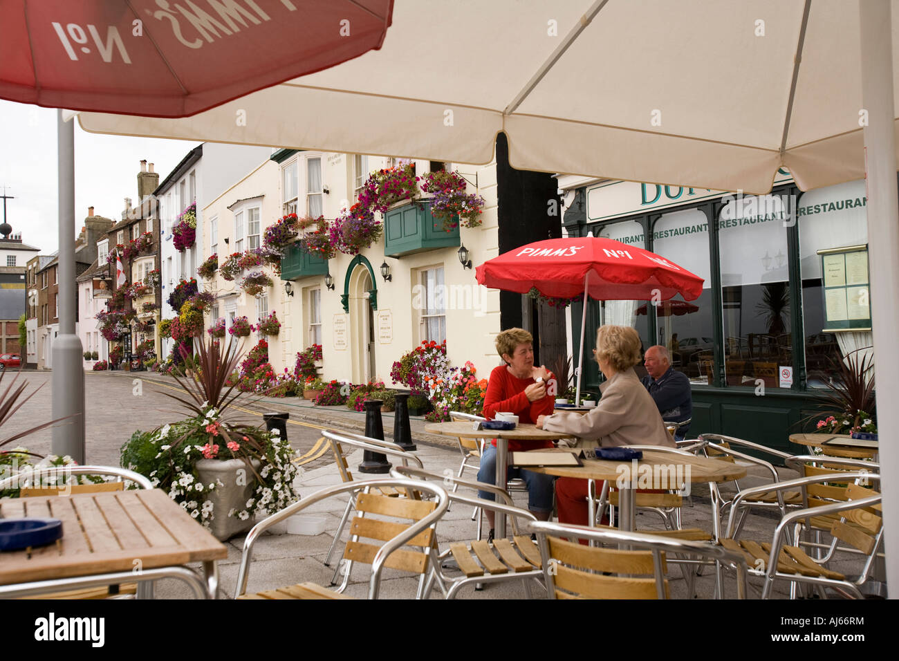 UK Kent Deal Beach Street seafront people sat outside Dunkerleys fish ...