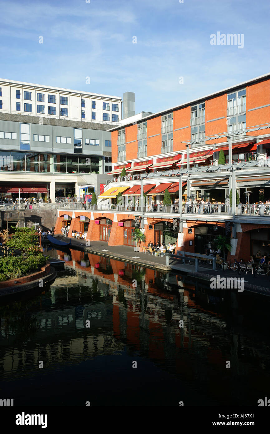 People eating lunch at the rear of the Mailbox development alondside ...