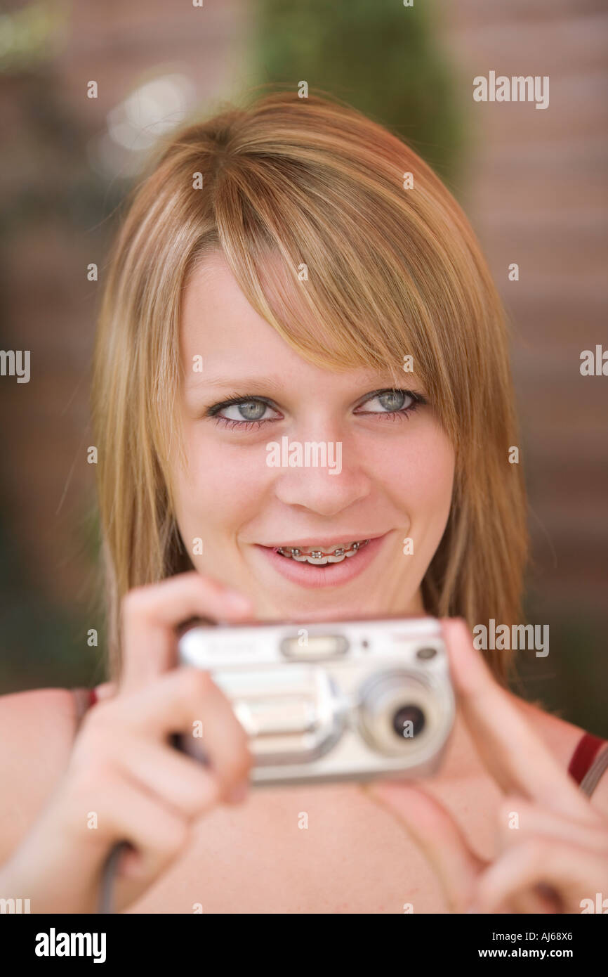 teenage girl using camera Stock Photo - Alamy