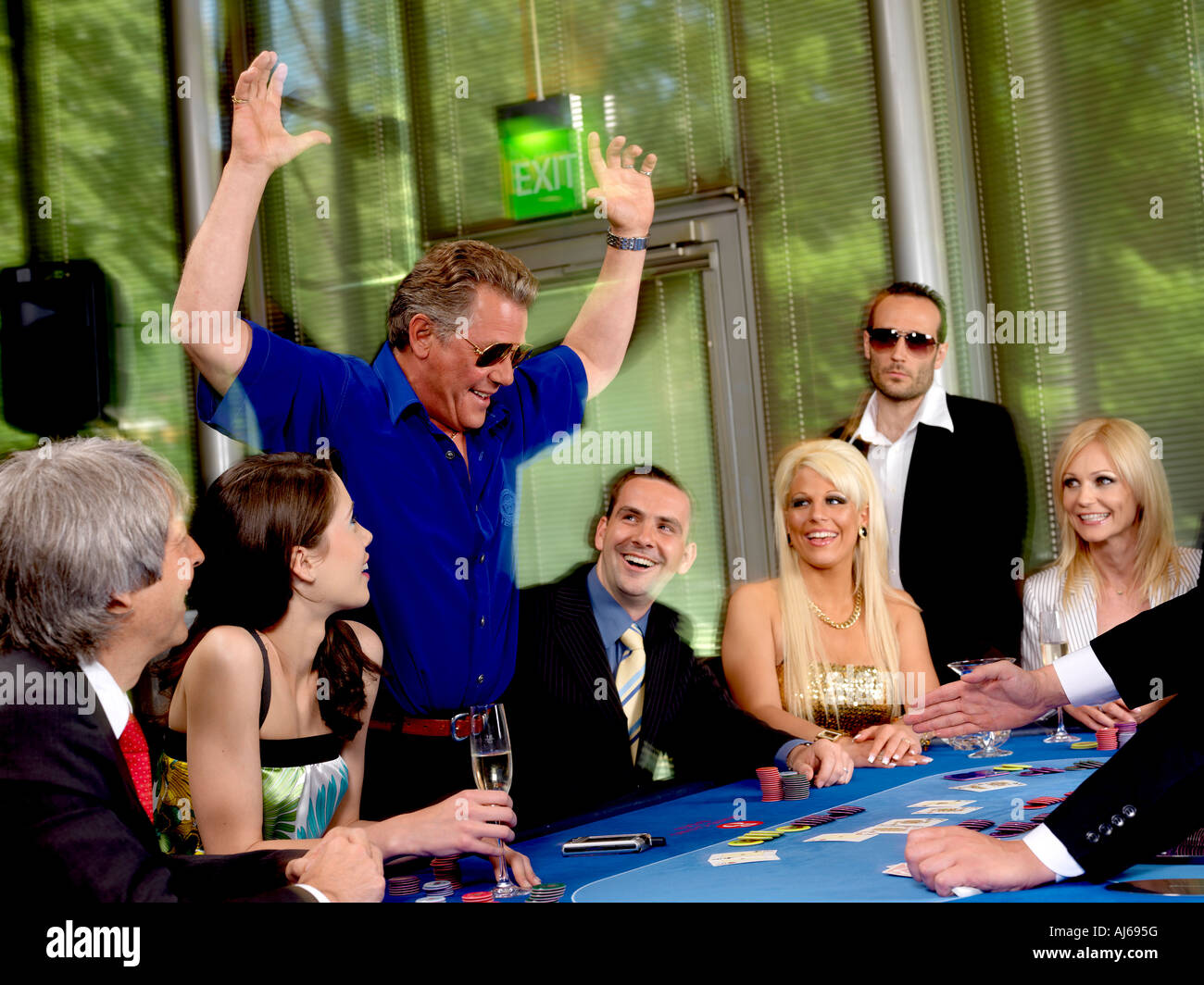 people playing a card game in a casino Stock Photo - Alamy