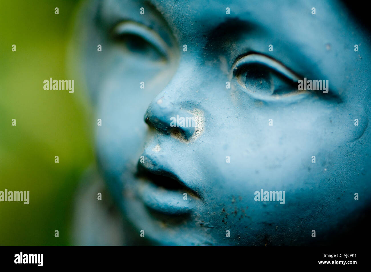 Face of a blue cherub statue Stock Photo - Alamy