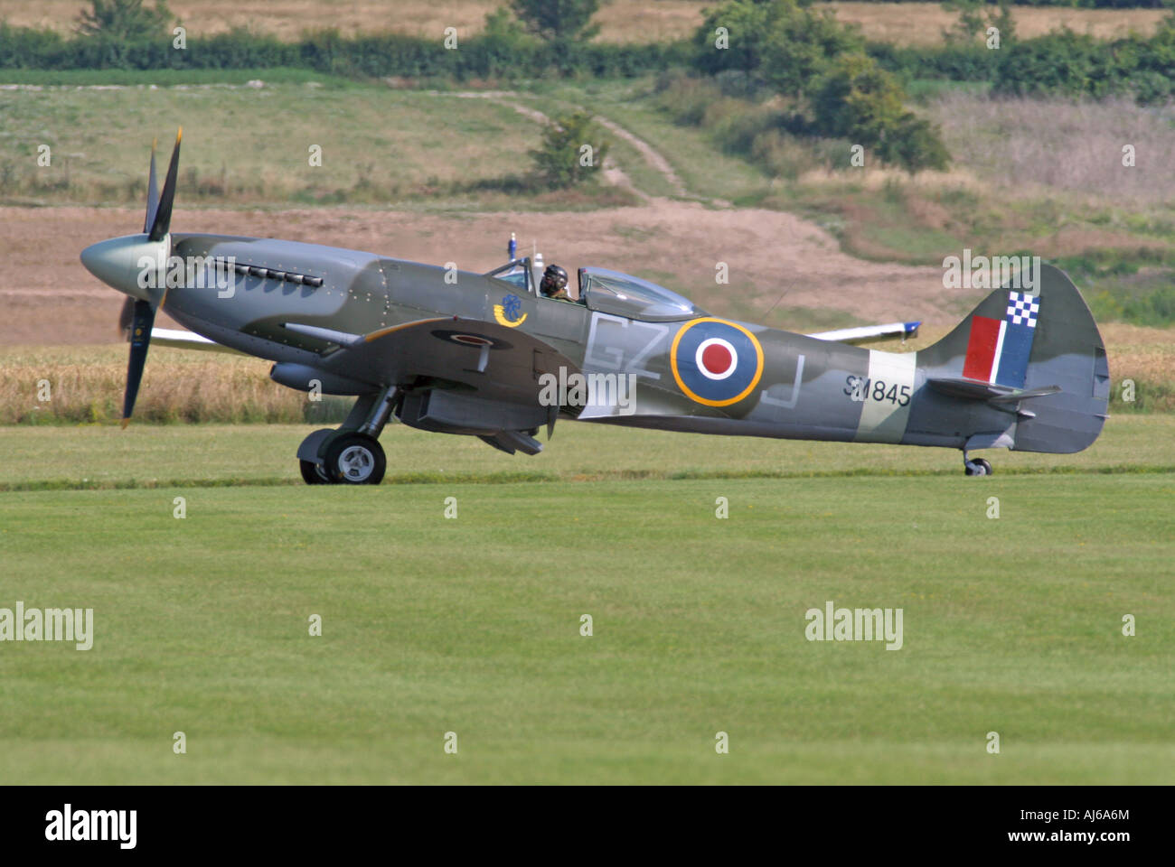 Griffon engined Spitfire taxing Duxford Airfield England UK Stock Photo ...