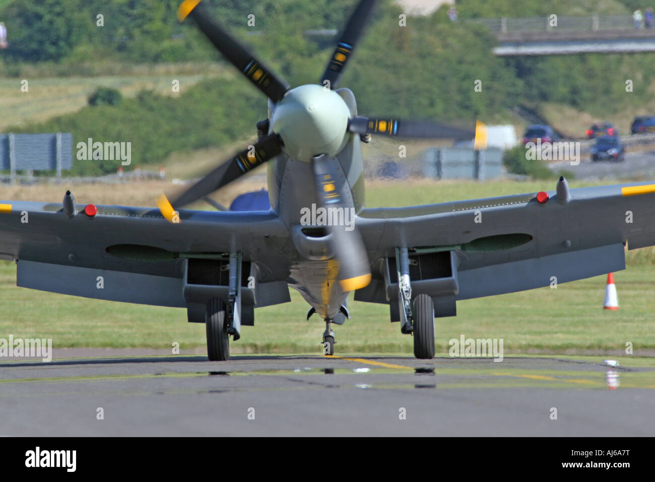 Griffon engined Spitfire taxing Duxford Airfield England UK Stock Photo ...