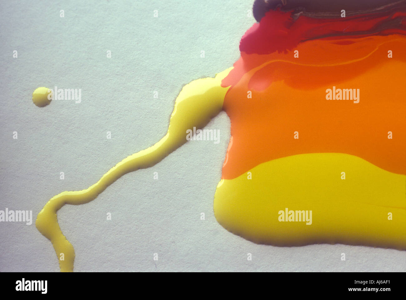 Brown red orange and yellow paint splatter with drop Stock Photo - Alamy