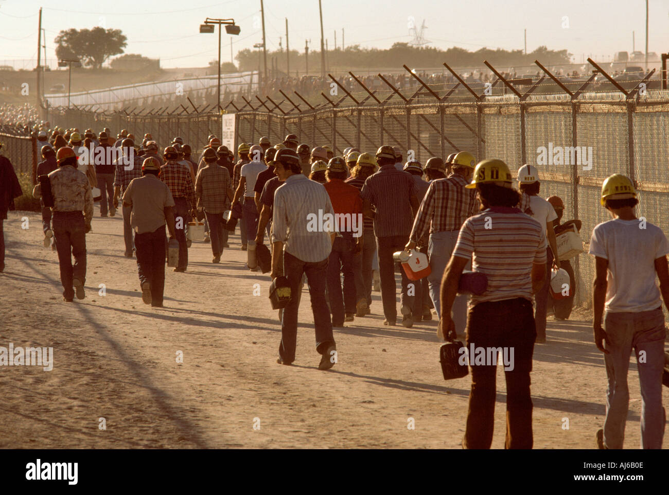 Workers leaving construction site Stock Photo - Alamy