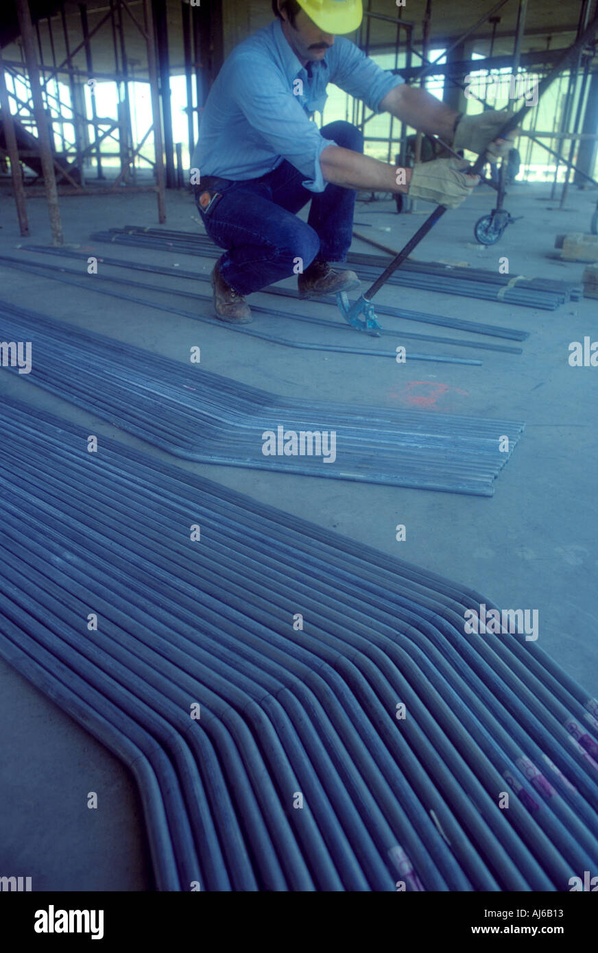 Electrician bending conduit in construction site Stock Photo - Alamy
