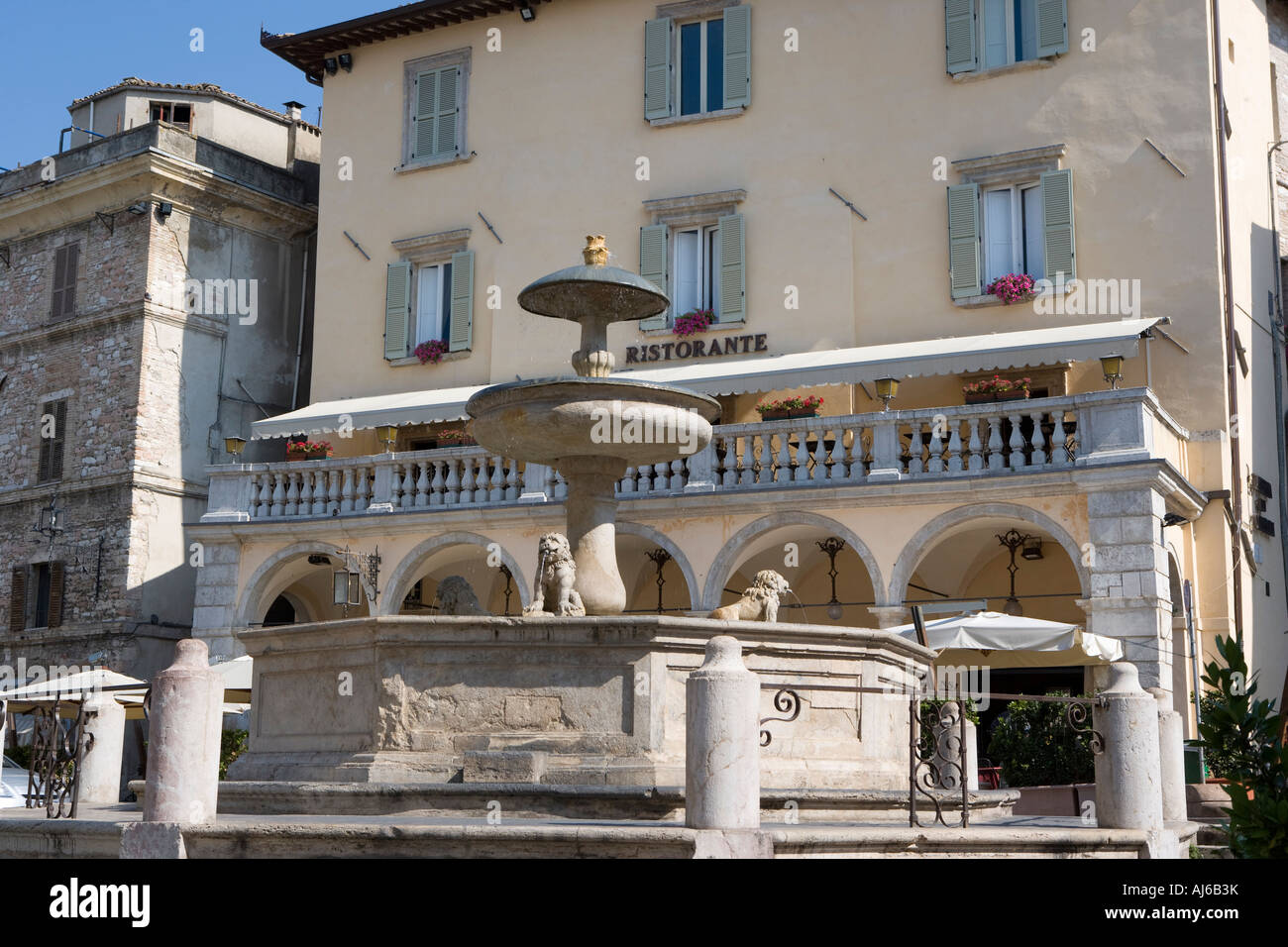 Assisi fountain in town centre Stock Photo - Alamy