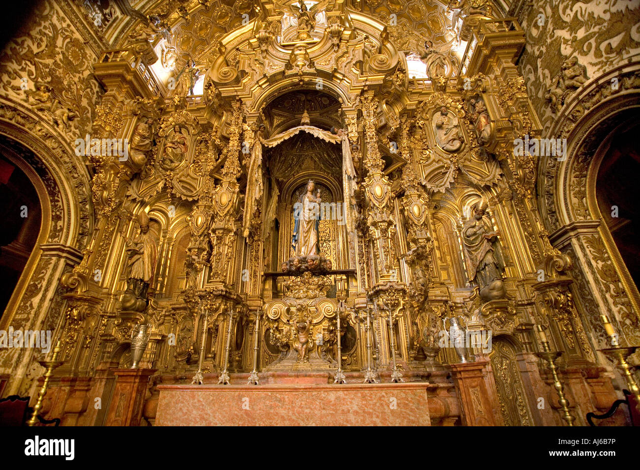 An elaborate golden alter inside the cathedral of Granada Cathedral of ...