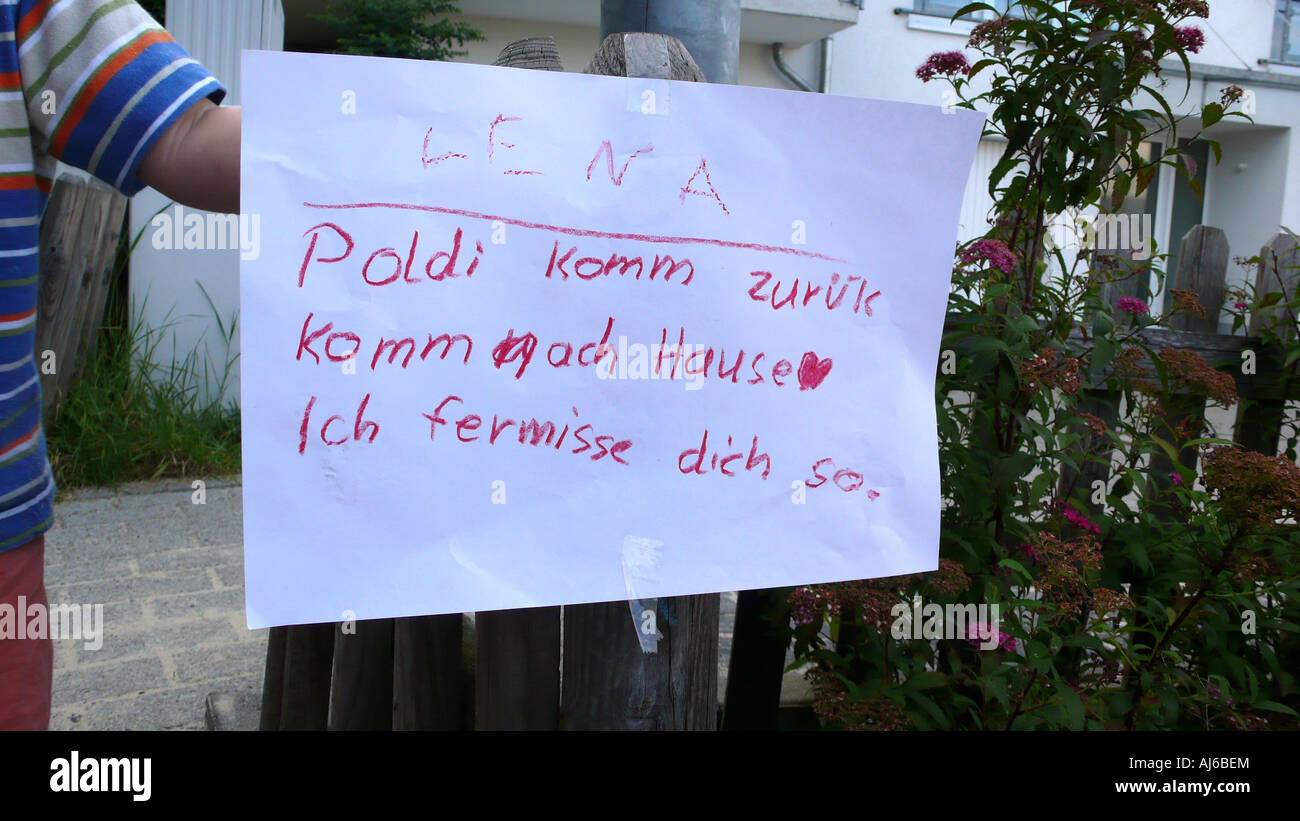 child making a wanted poster for an escaped rabbit, Germany Stock Photo ...