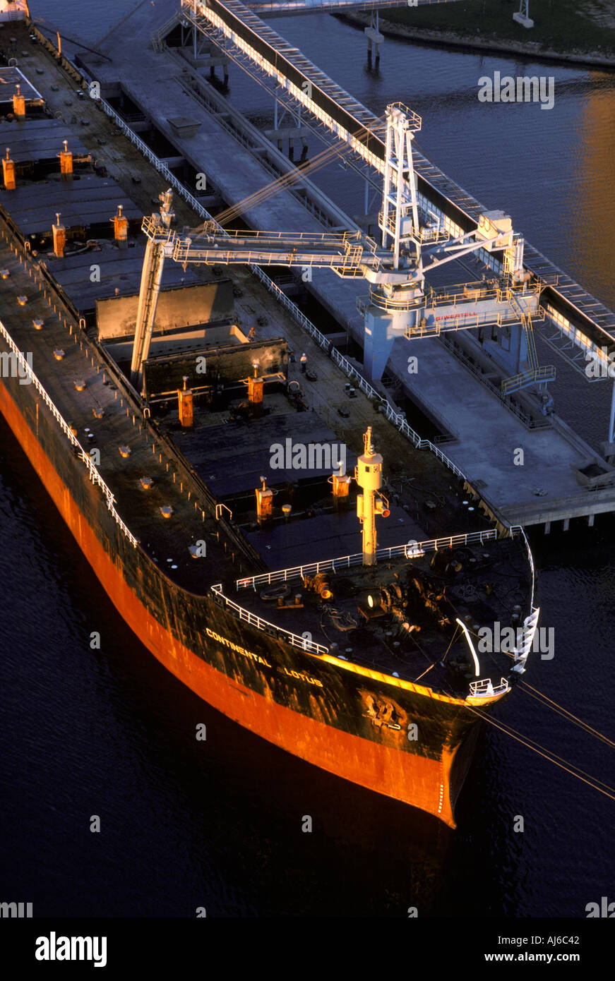 Cargo ship being loaded at dock in ship channel Houston Texas Stock ...