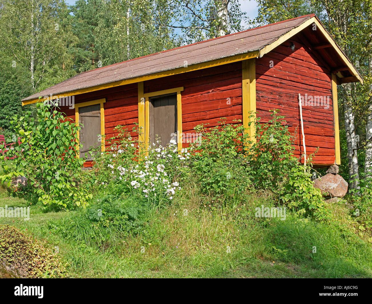 typical scandinavian red wooden timber cabin in Finland Stock Photo - Alamy